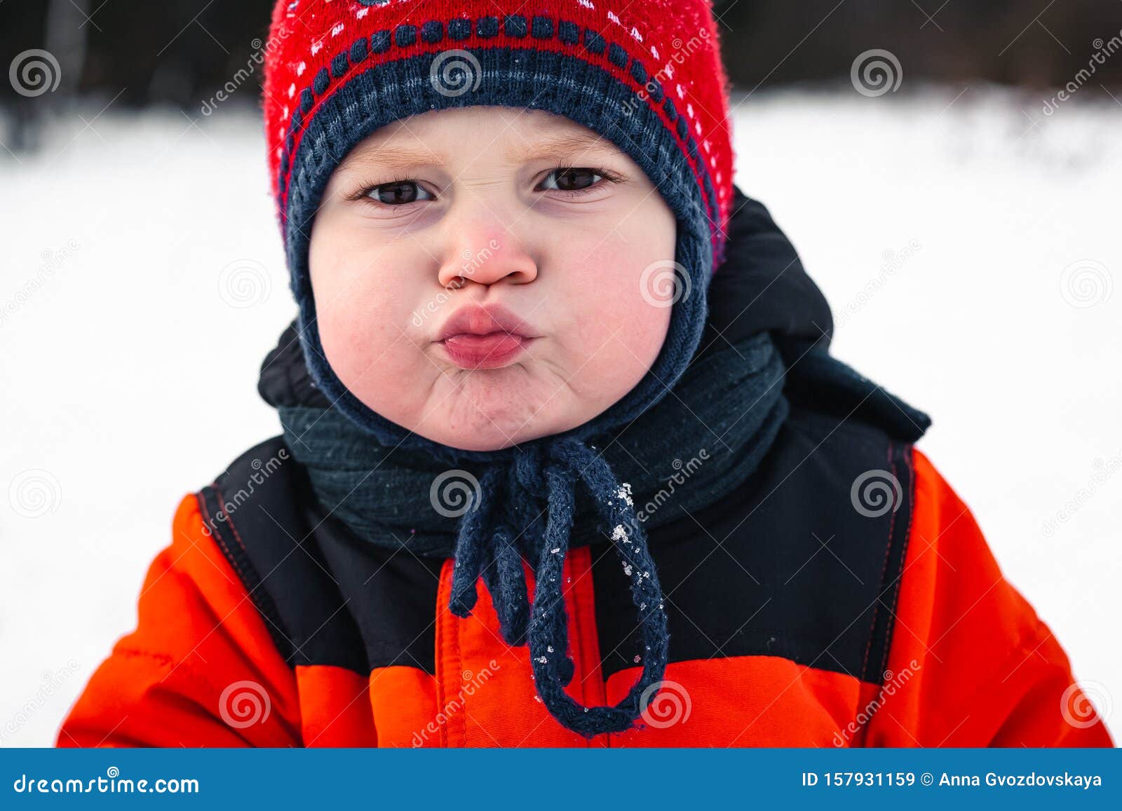 Funny Expression of a Boy Puckering His Lips in the Winter Outside ...