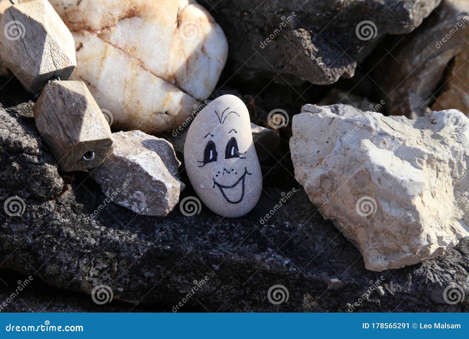 Funny Face is Drawn on a Round Pebble Stock Image - Image of children ...