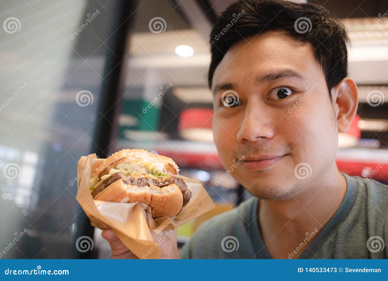 Funny Face Expression of Asian Man Eat a Hamburger Stock Image - Image ...