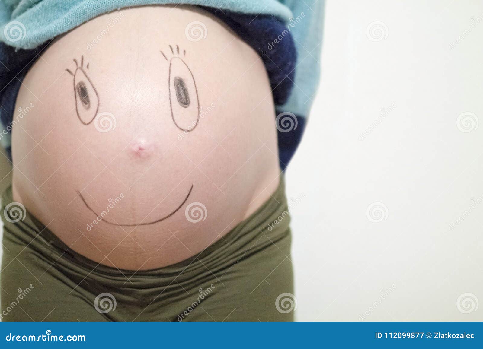 Funny faces on a belly stock image. Image of childbirth - 112099877