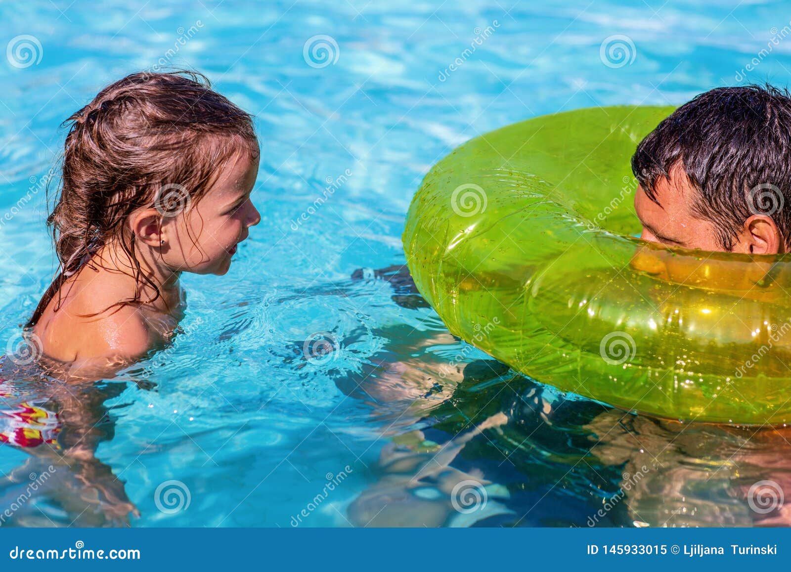 Funny Father And Daughter Playing In Swimming Pool Summer Vacation