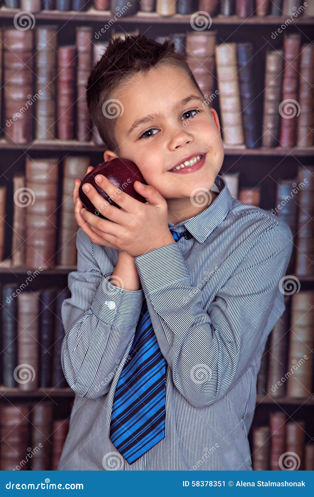 Funny First-Grade Schoolgirl Holding Stack Of Books And Microscope ...
