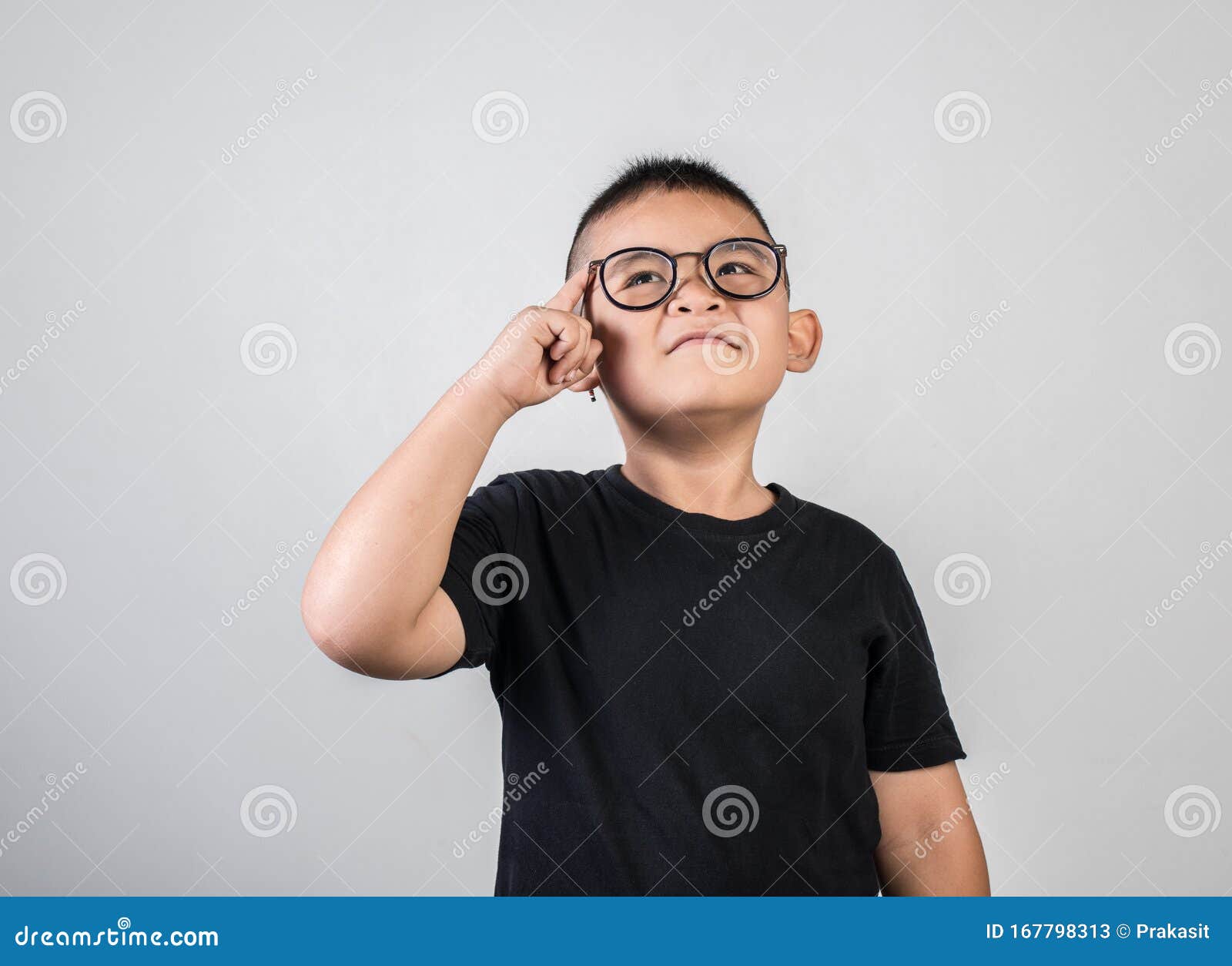 Genius Boy Thinking in Studio Shot Stock Image - Image of thinking ...