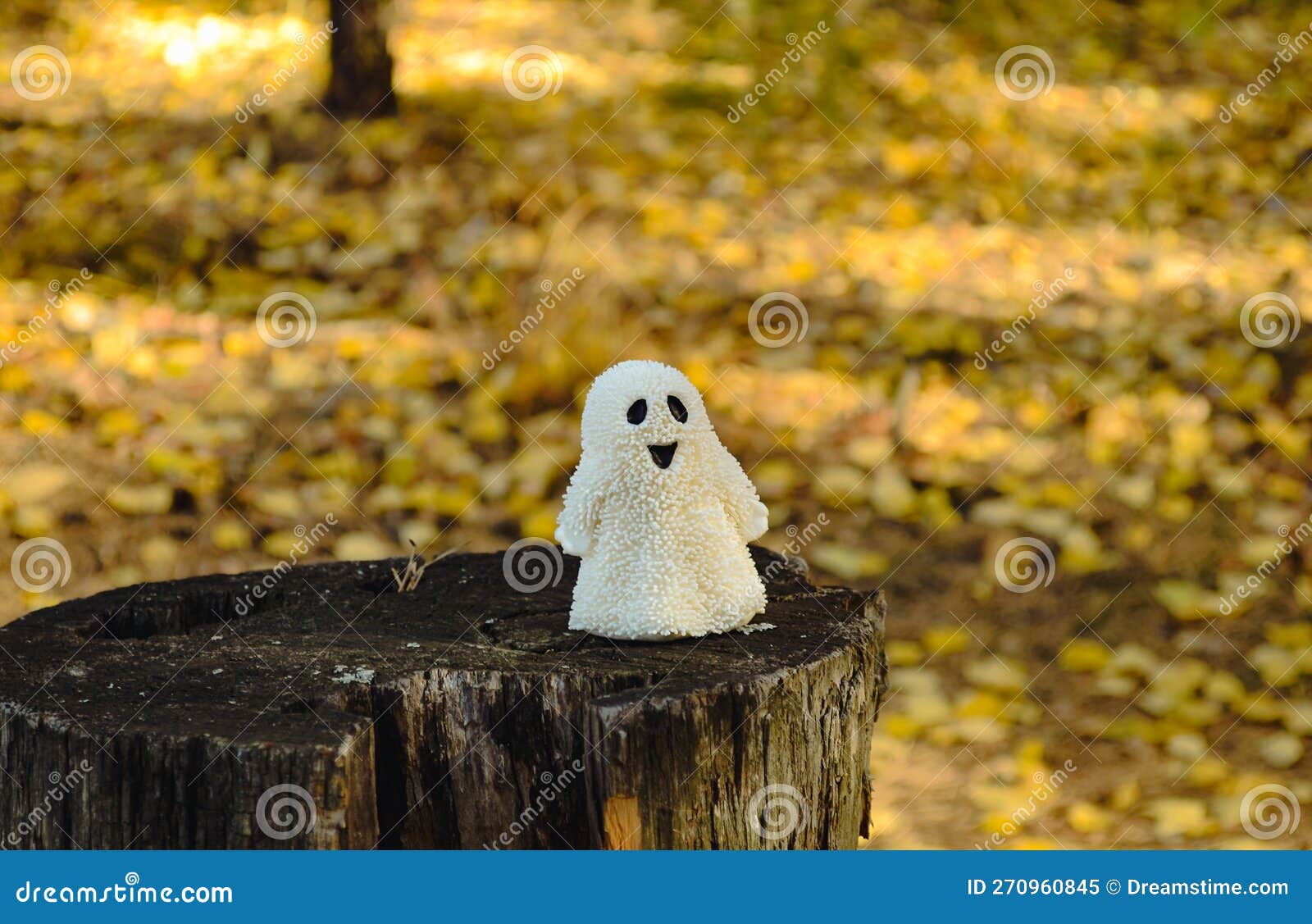 Funny Ghost Toy Stands on an Old Stump in the Autumn Forest Stock Image ...