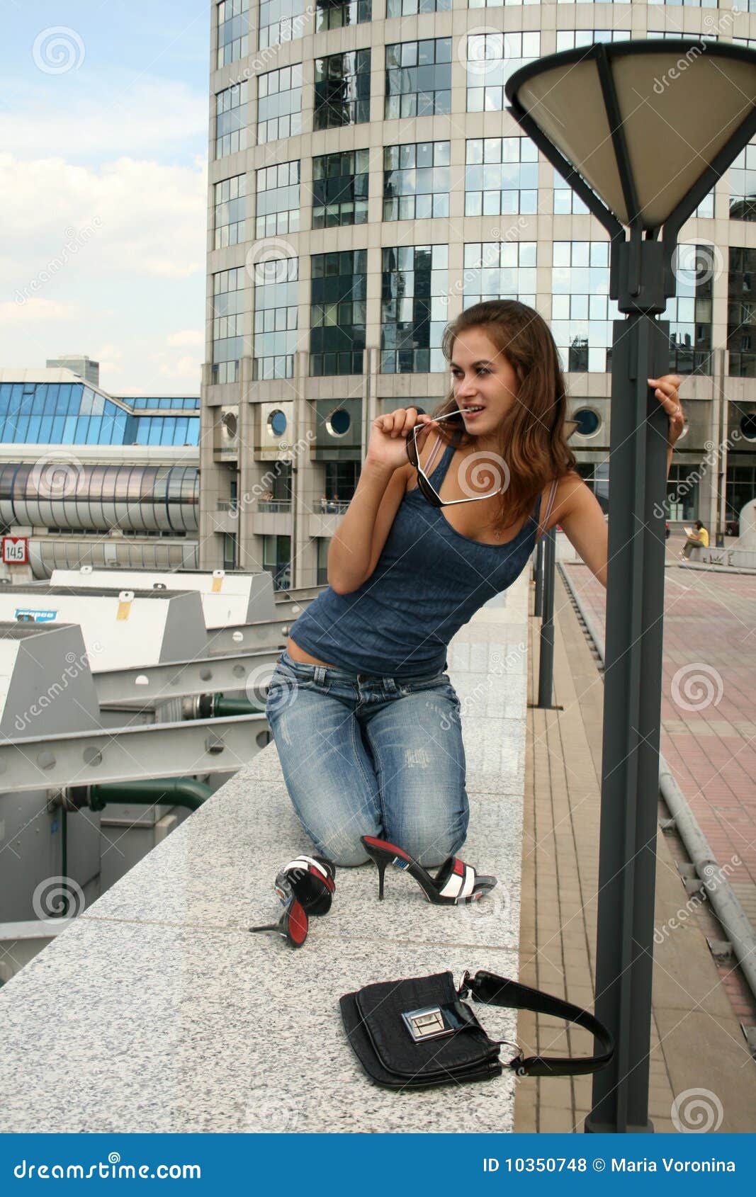 Funny Girl Sitting on Railing Stock Photo - Image of buildings ...