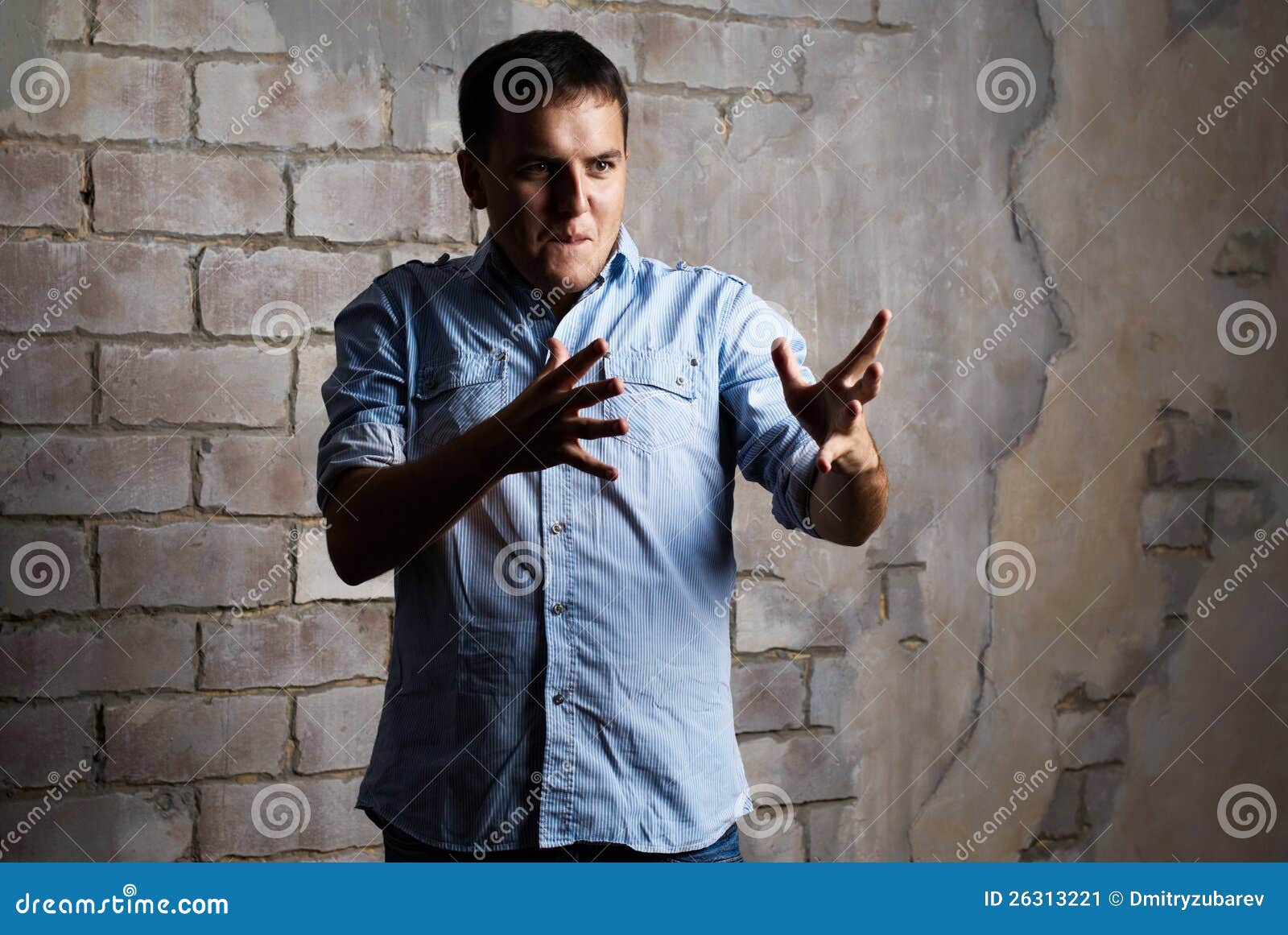 Funny guy against wall stock image. Image of annoyed - 26313221