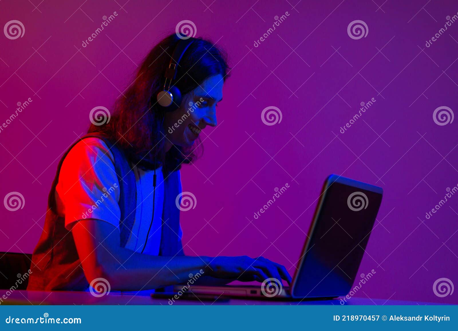 Funny Guy Gamer Playing on a Laptop. a Young Man with Headphones Stock ...