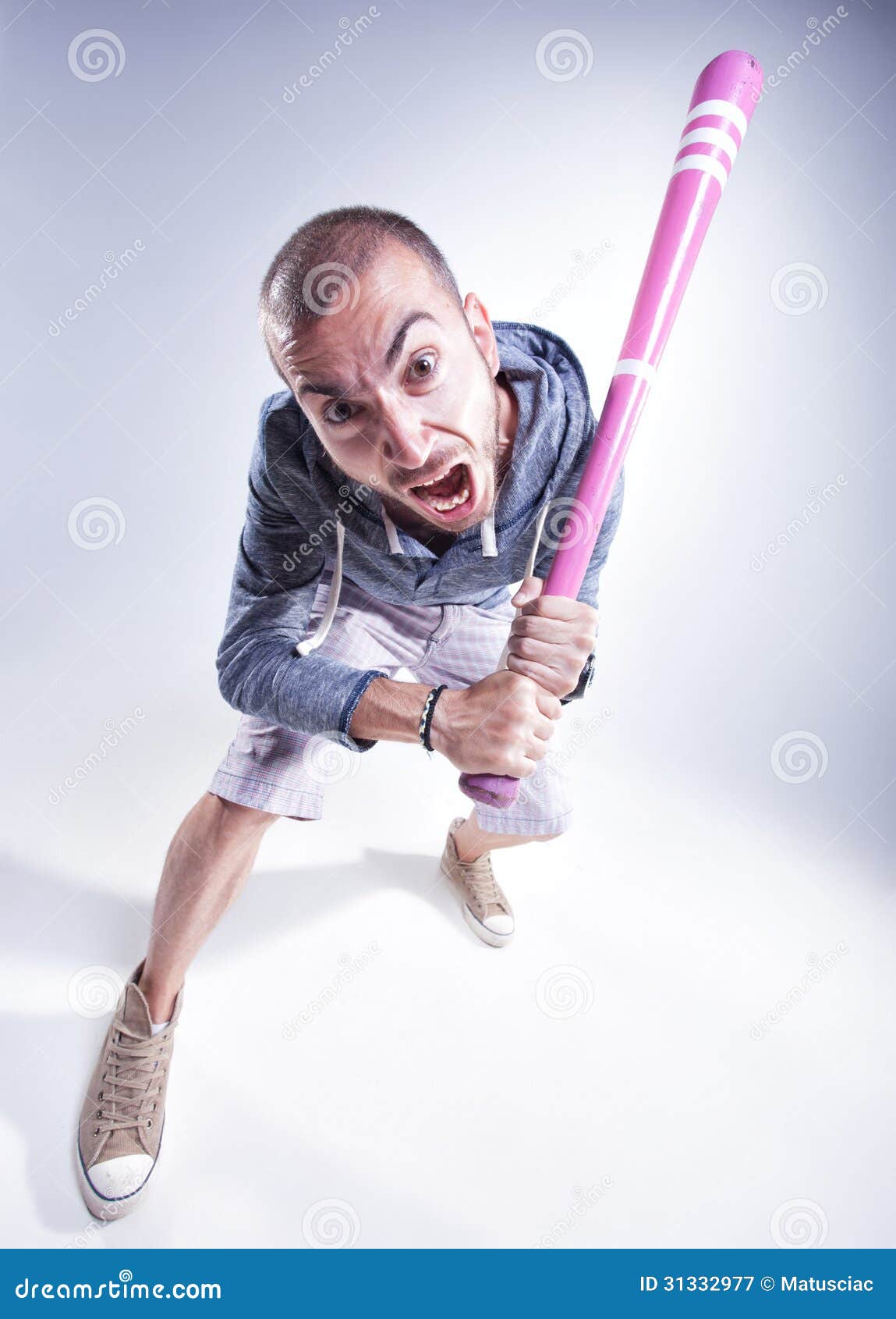 Funny Hooligan with a Pink Baseball Bat Screaming in the Studio Stock ...