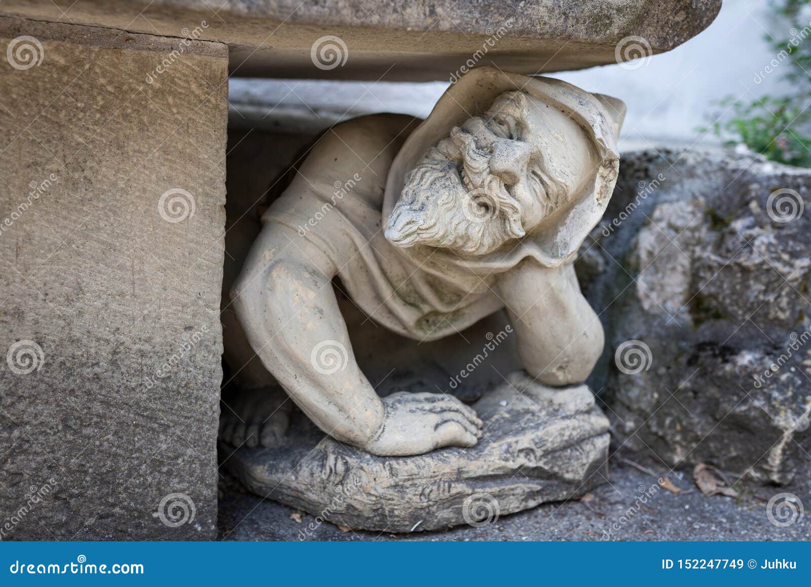 Funny Human Statue Crouching Under Bench in Garden Stock Image - Image ...