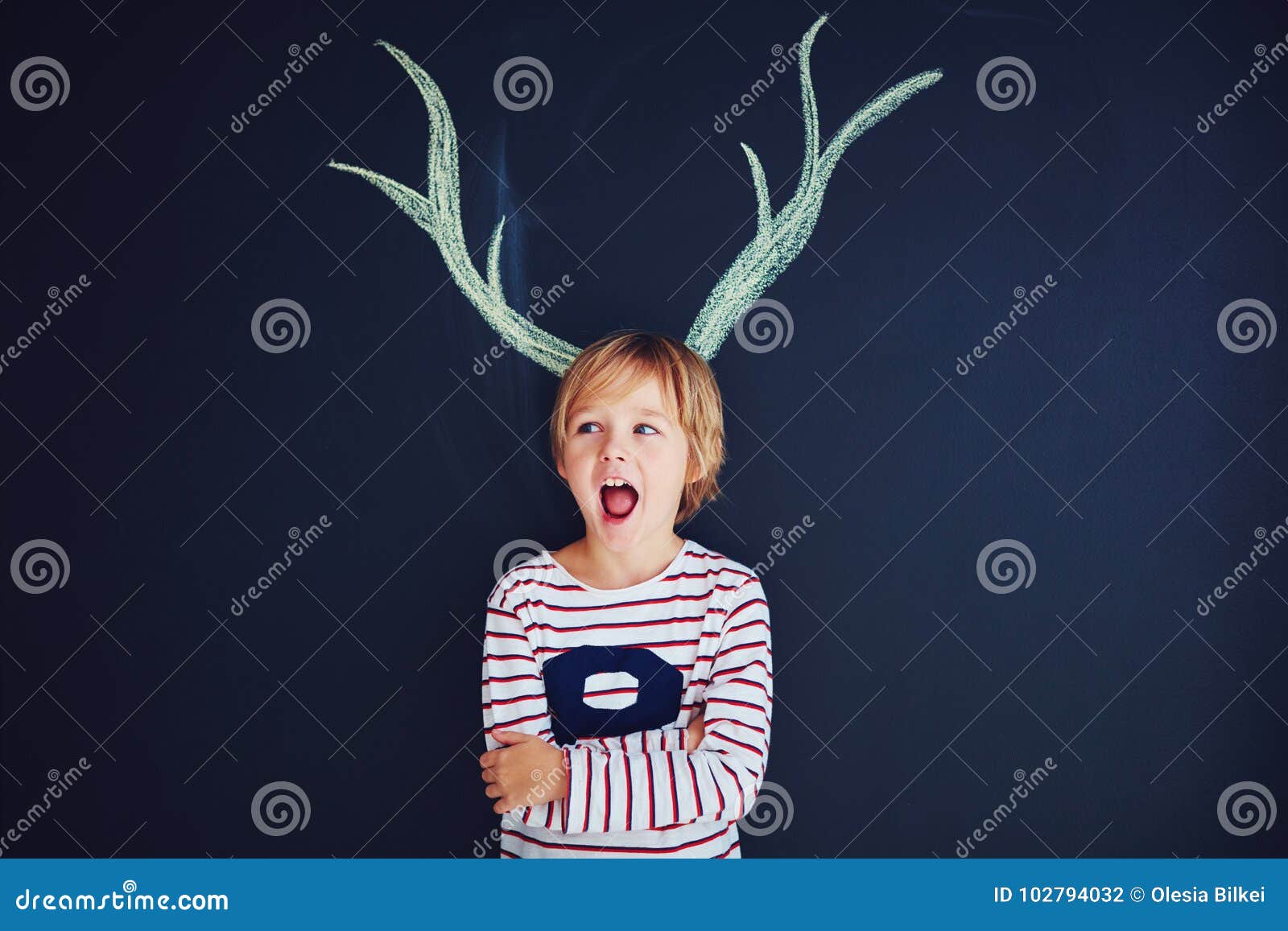 Funny Kid, Boy with Drawn Antlers Standing in Front of a Chalk Wall ...