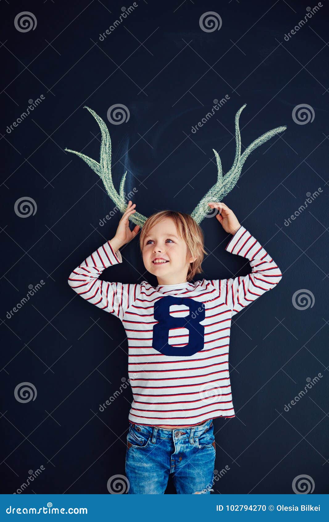 Funny Kid, Boy with Drawn Antlers Standing in Front of a Chalk Wall ...