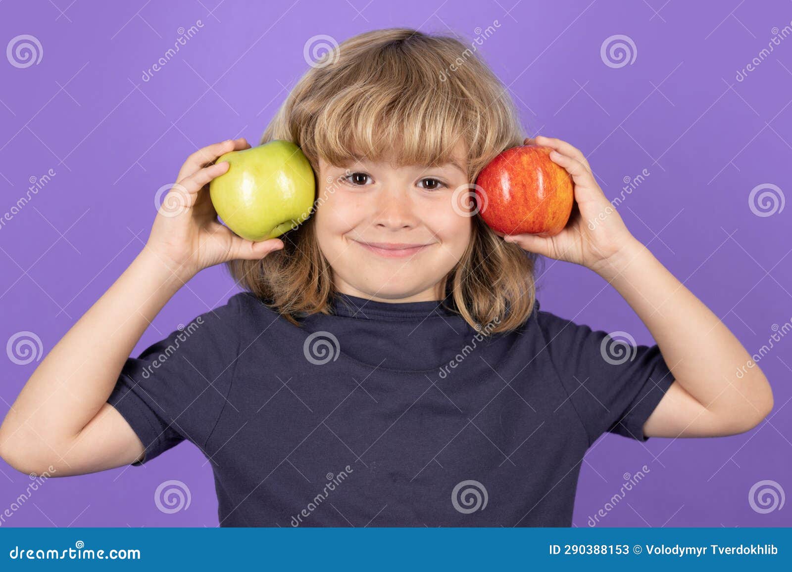 Funny Kid Boy Hold a Red Apple and a Green Apple. Isolated on Studio ...