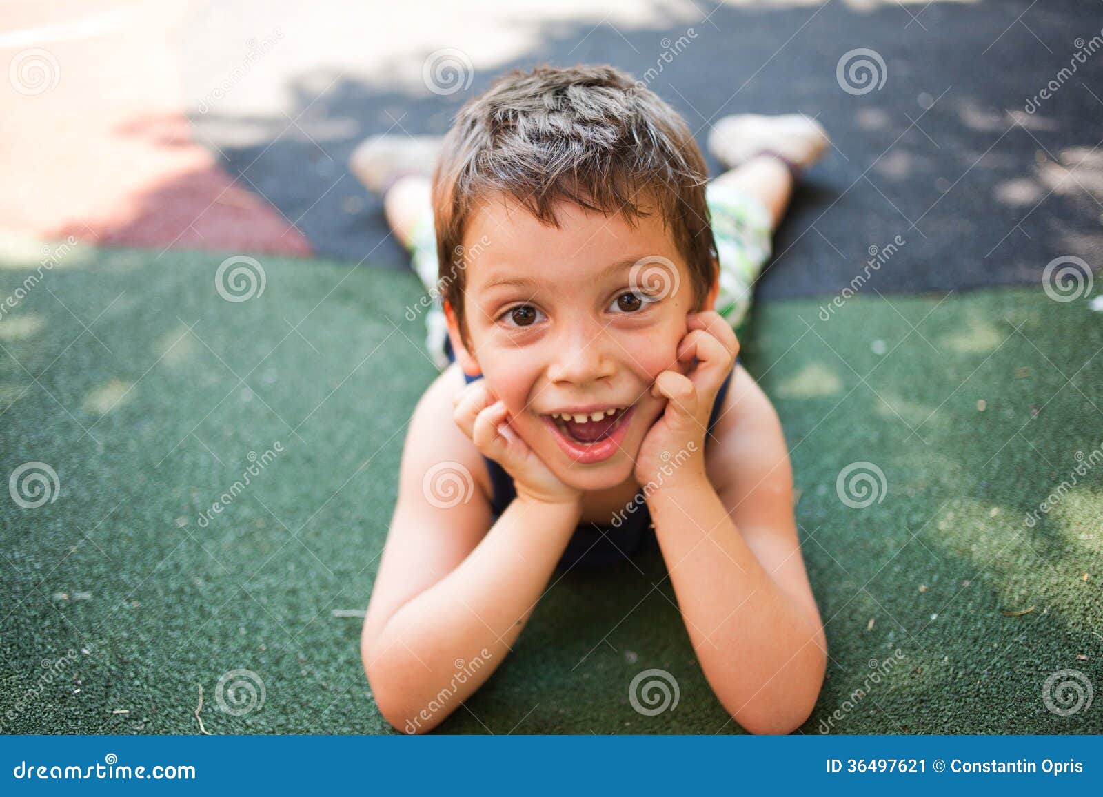 Funny Kid Sitting on Ground Stock Image - Image of smiling, play: 36497621