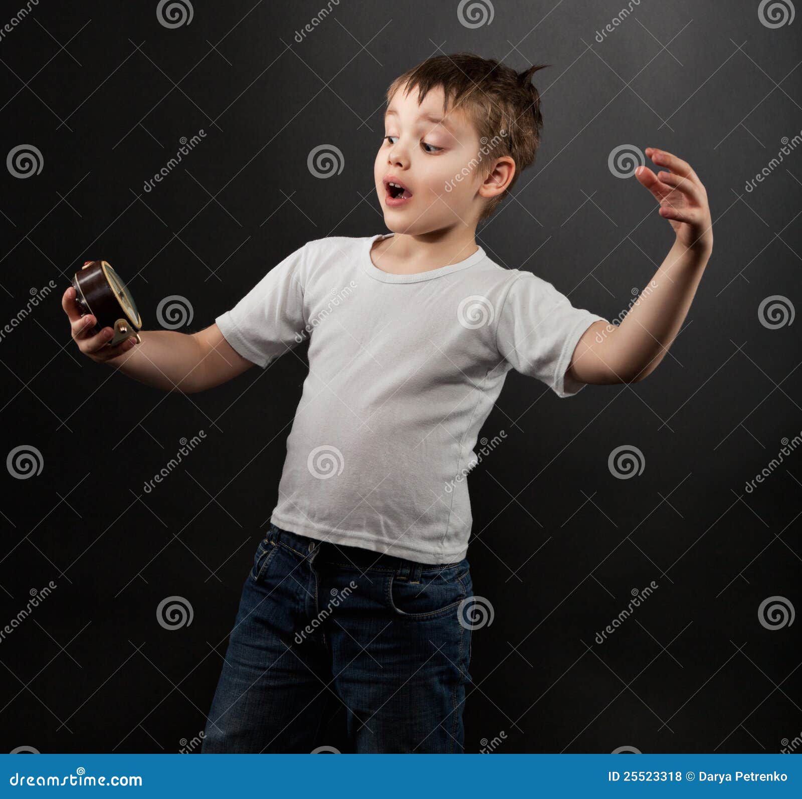 Funny Little Boy Looking at Alarm Clock Stock Photo - Image of white ...