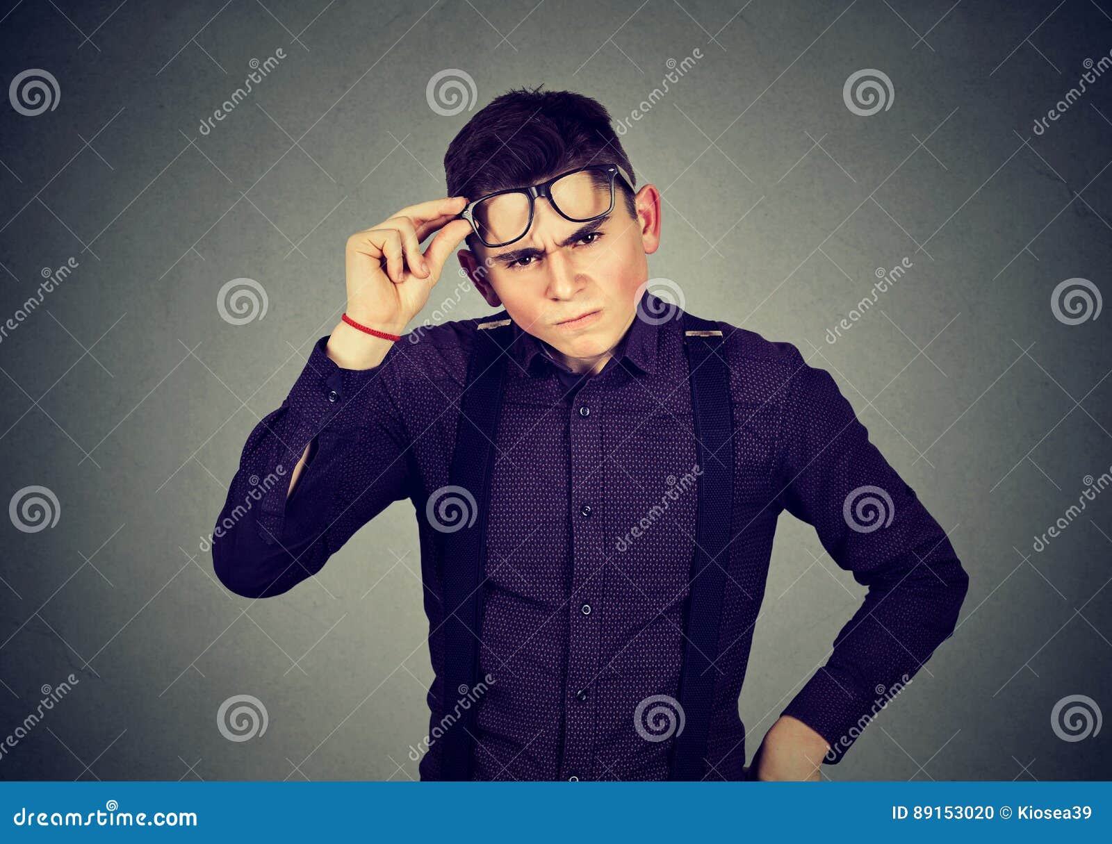 Funny Looking Skeptical Grumpy Young Man in Glasses Stock Photo - Image ...