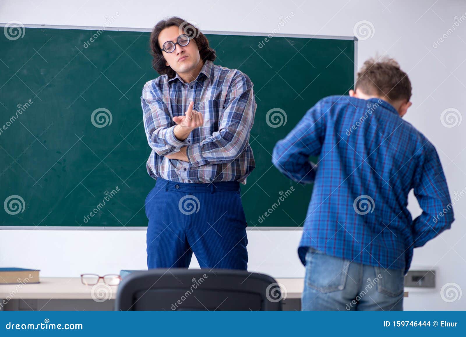 Funny Male Teacher and Boy in the Classroom Stock Photo - Image of ...