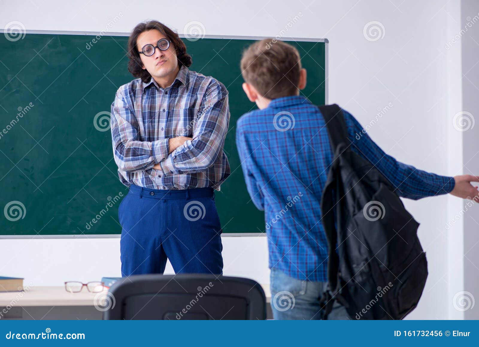 Funny Male Teacher and Boy in the Classroom Stock Photo - Image of ...