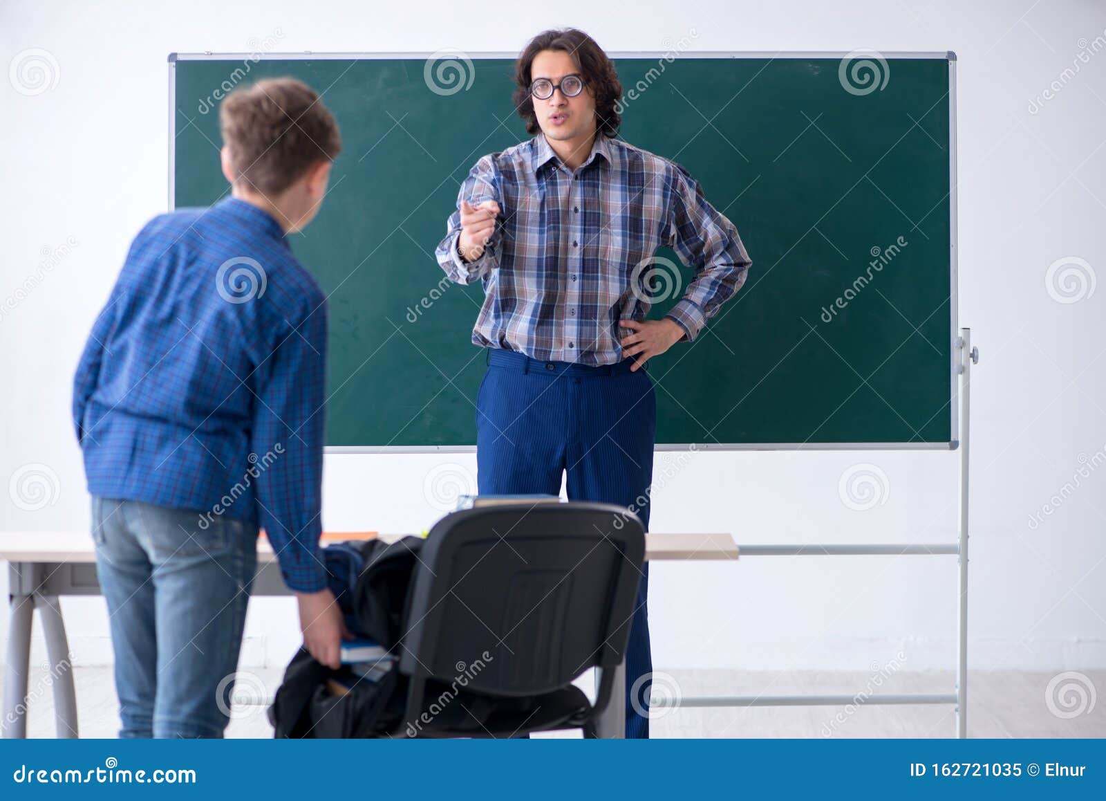 Funny Male Teacher and Boy in the Classroom Stock Image - Image of ...