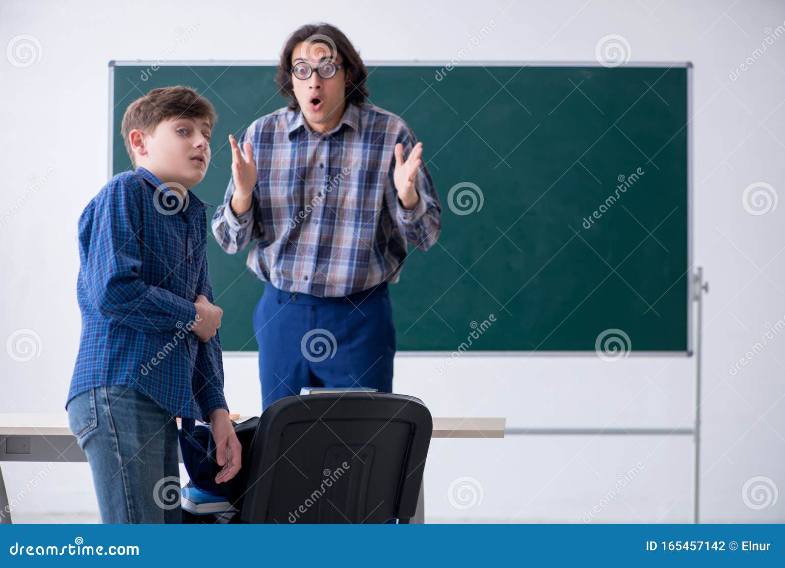 Funny Male Teacher and Boy in the Classroom Stock Photo - Image of ...