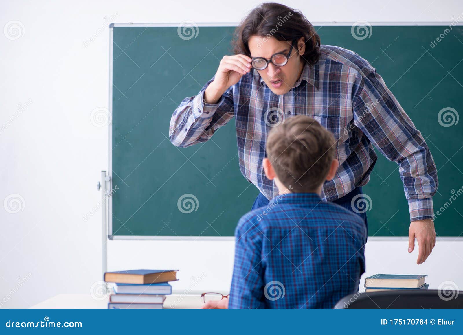 Funny Male Teacher and Boy in the Classroom Stock Photo - Image of ...