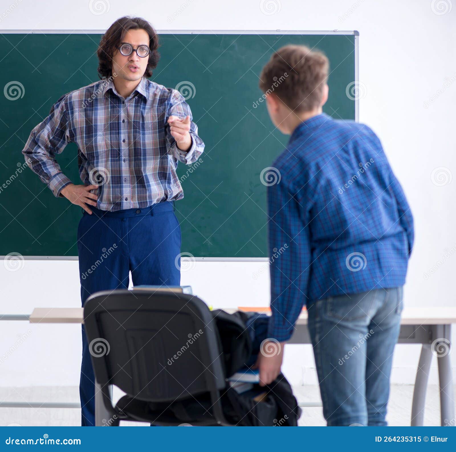 Funny Male Teacher and Boy in the Classroom Stock Image - Image of ...