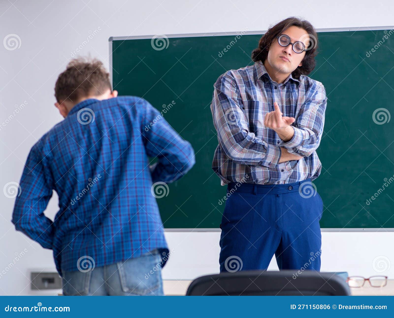 Funny Male Teacher and Boy in the Classroom Stock Photo - Image of ...