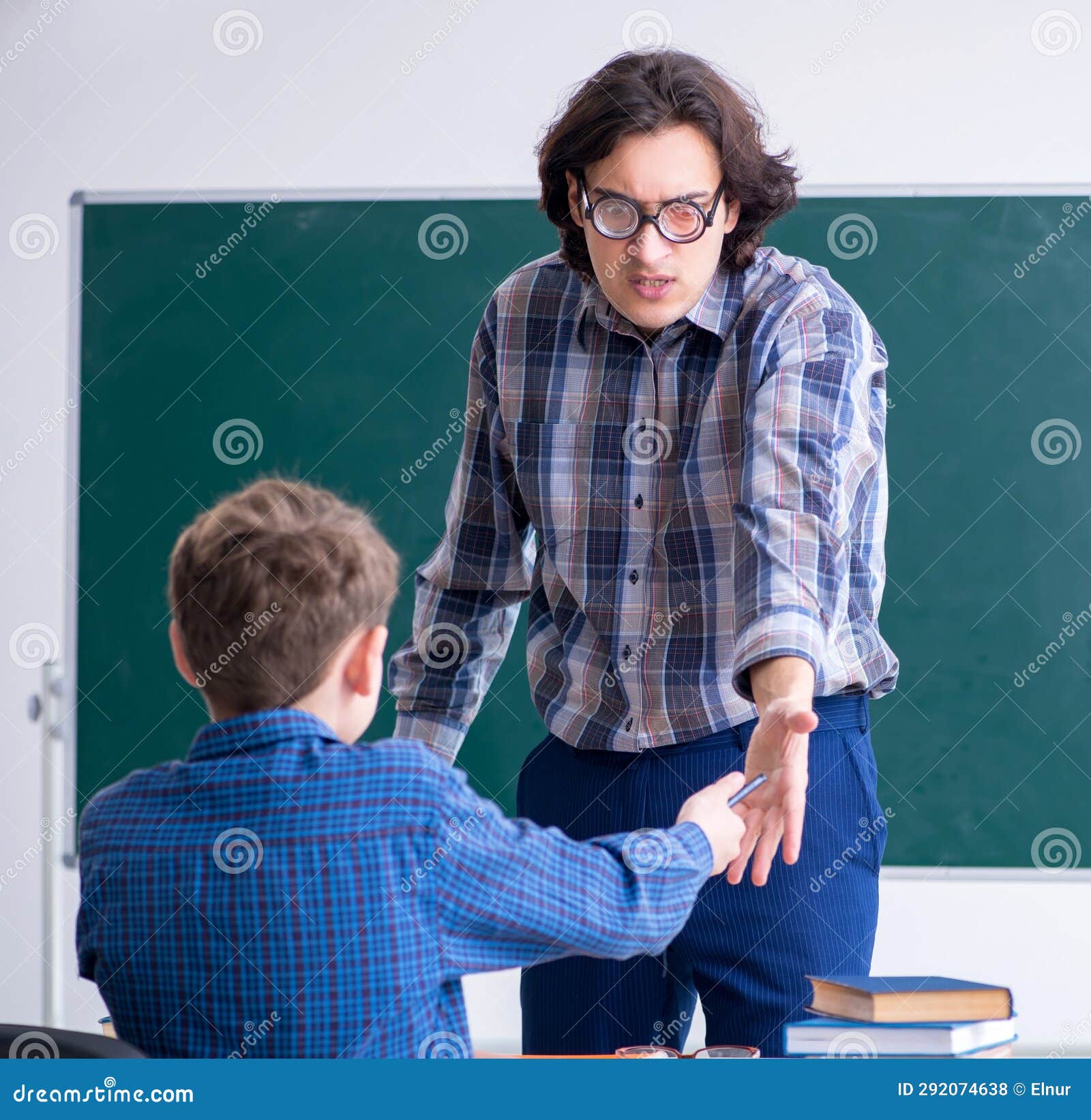 Funny Male Teacher and Boy in the Classroom Stock Photo - Image of ...
