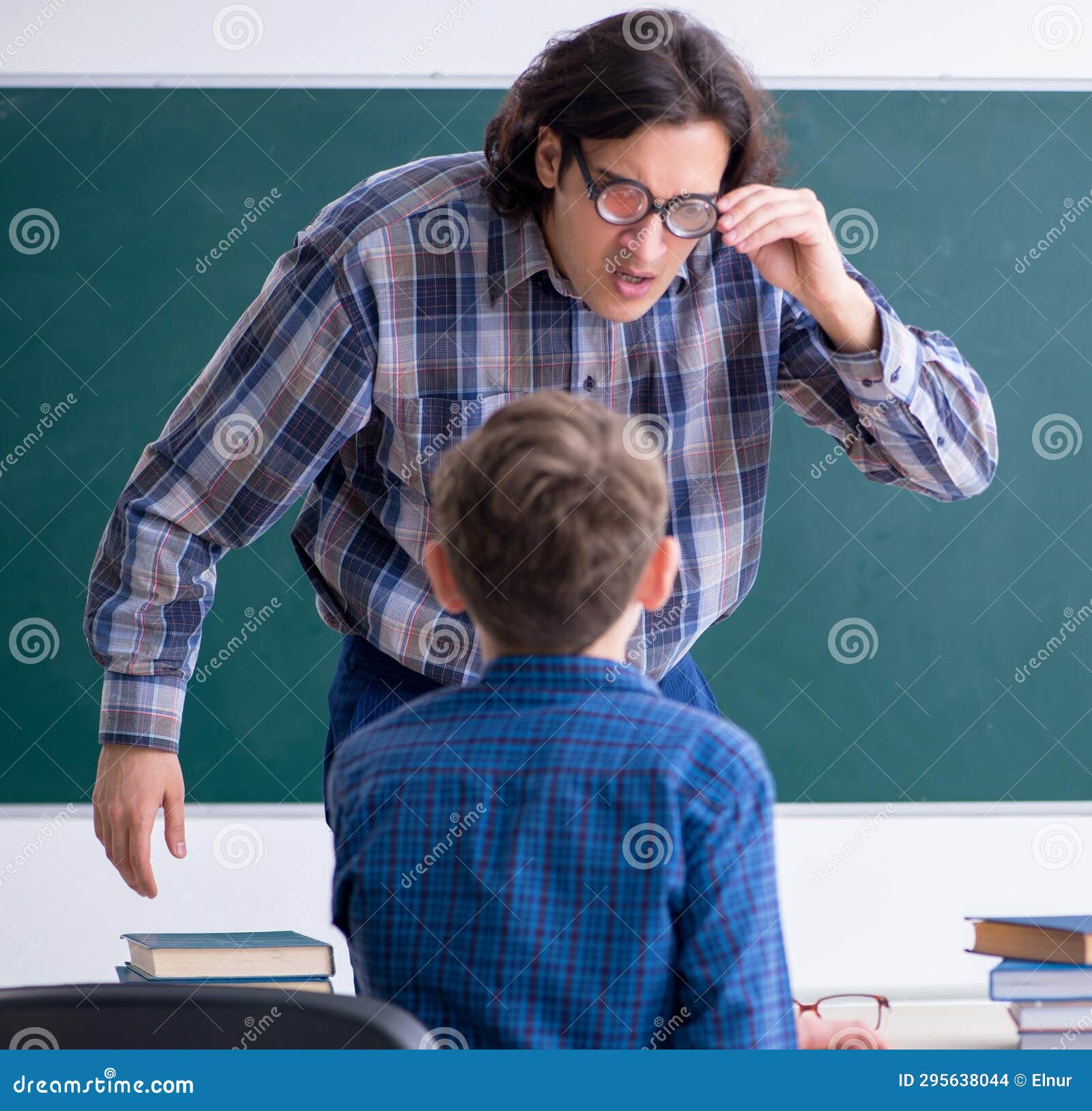 Funny Male Teacher and Boy in the Classroom Stock Photo - Image of ...