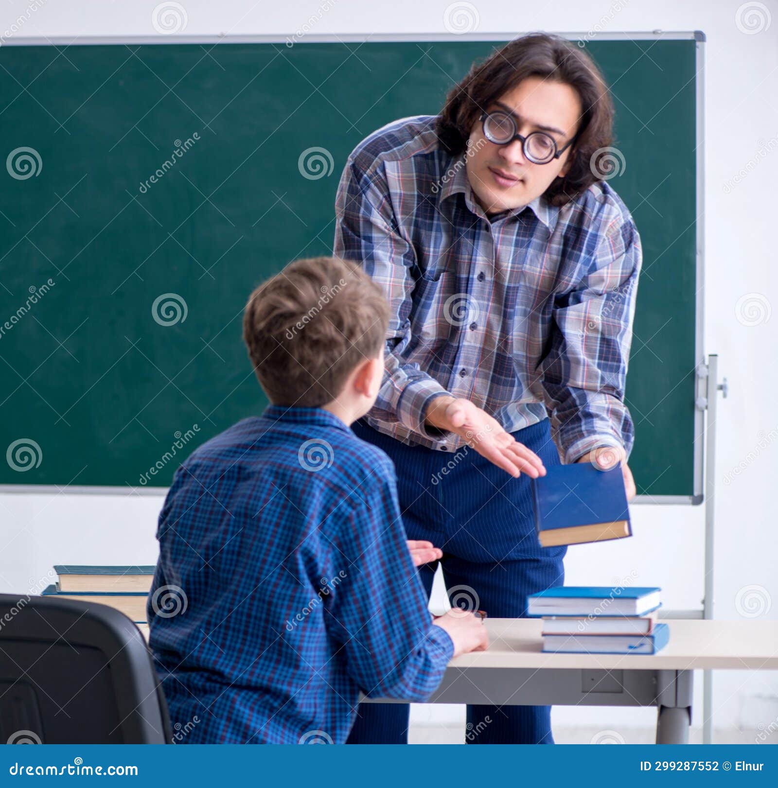 Funny Male Teacher and Boy in the Classroom Stock Photo - Image of ...