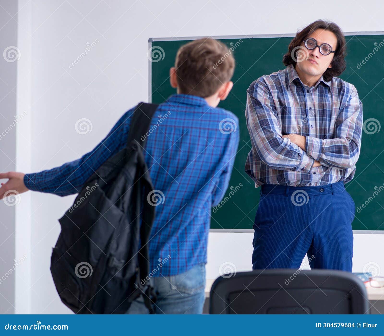 Funny Male Teacher and Boy in the Classroom Stock Photo - Image of ...