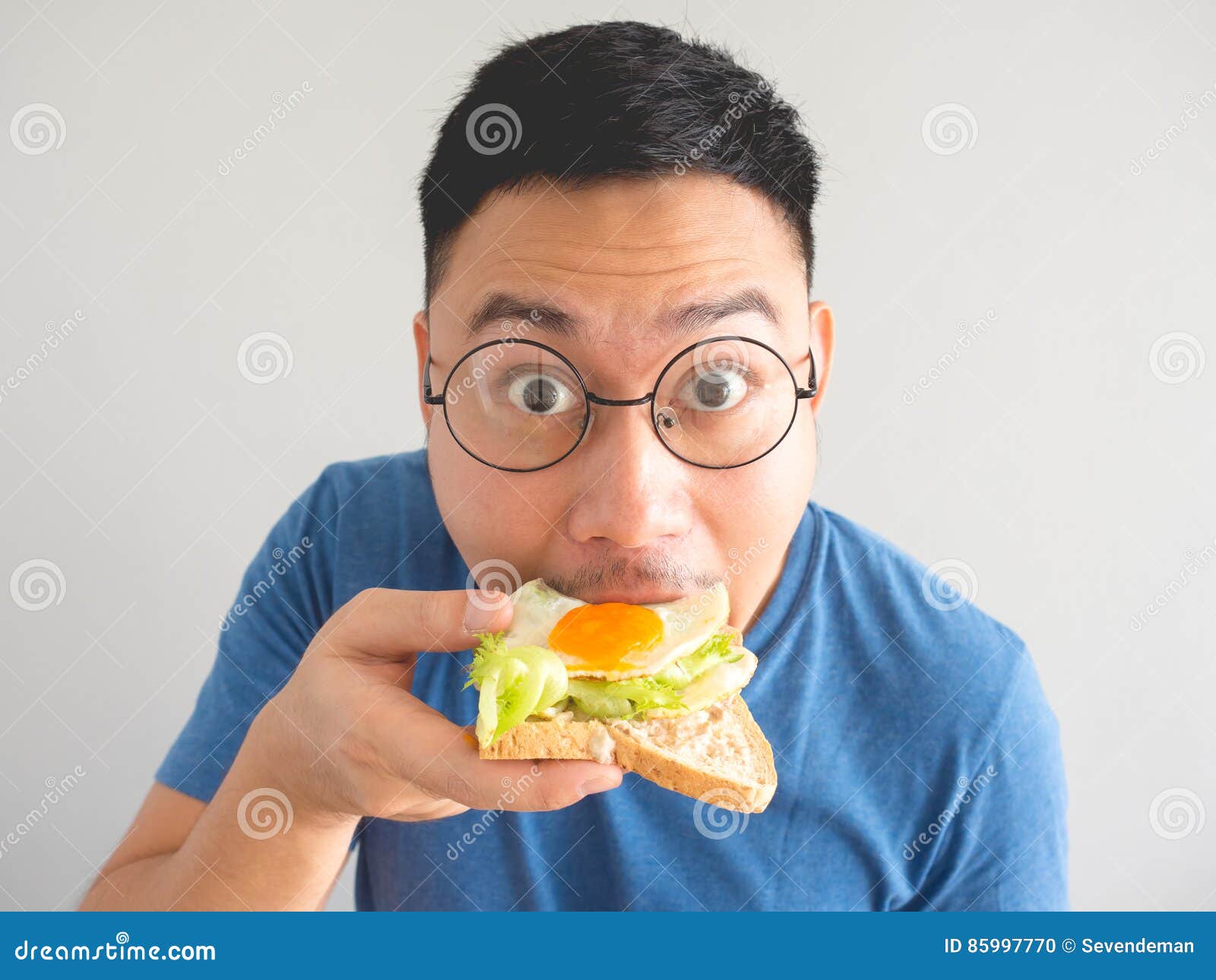 Funny man eat sandwich. stock photo. Image of grease - 85997770