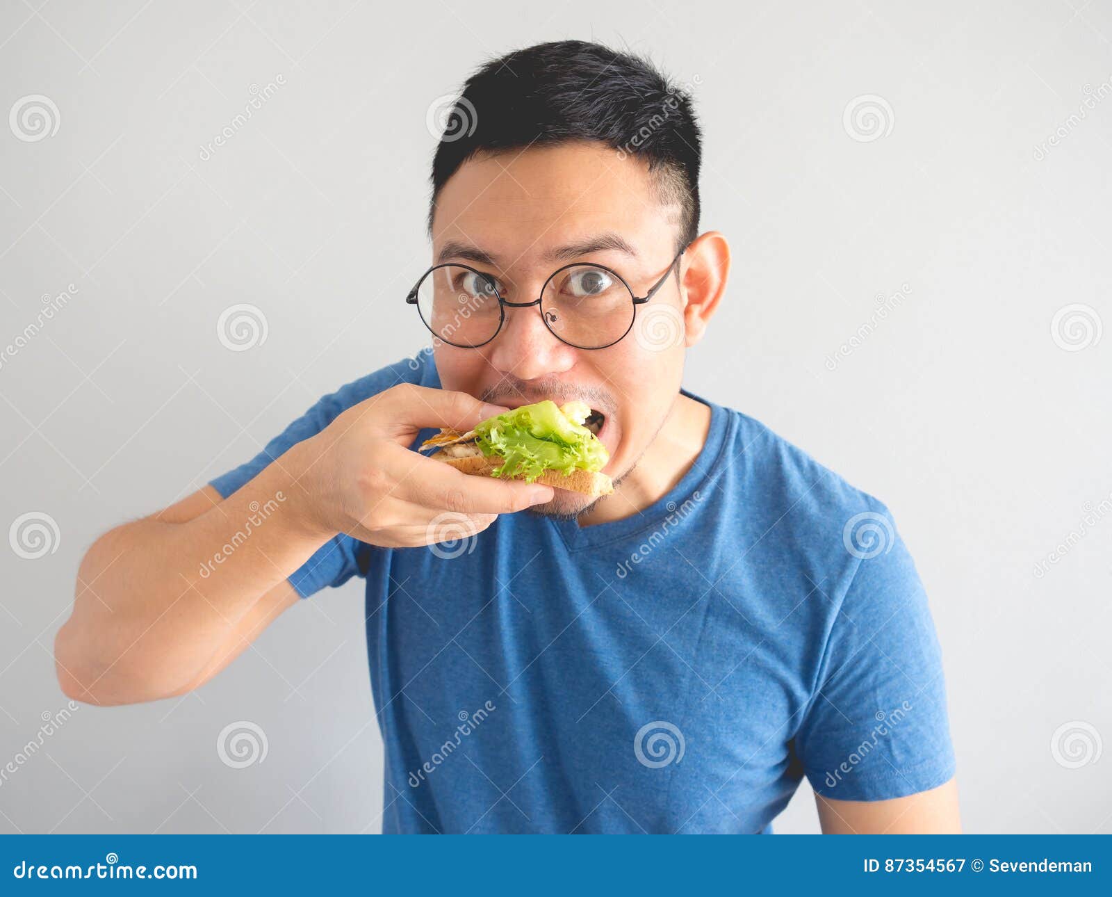 Funny man eat sandwich. stock image. Image of face, casual - 87354567