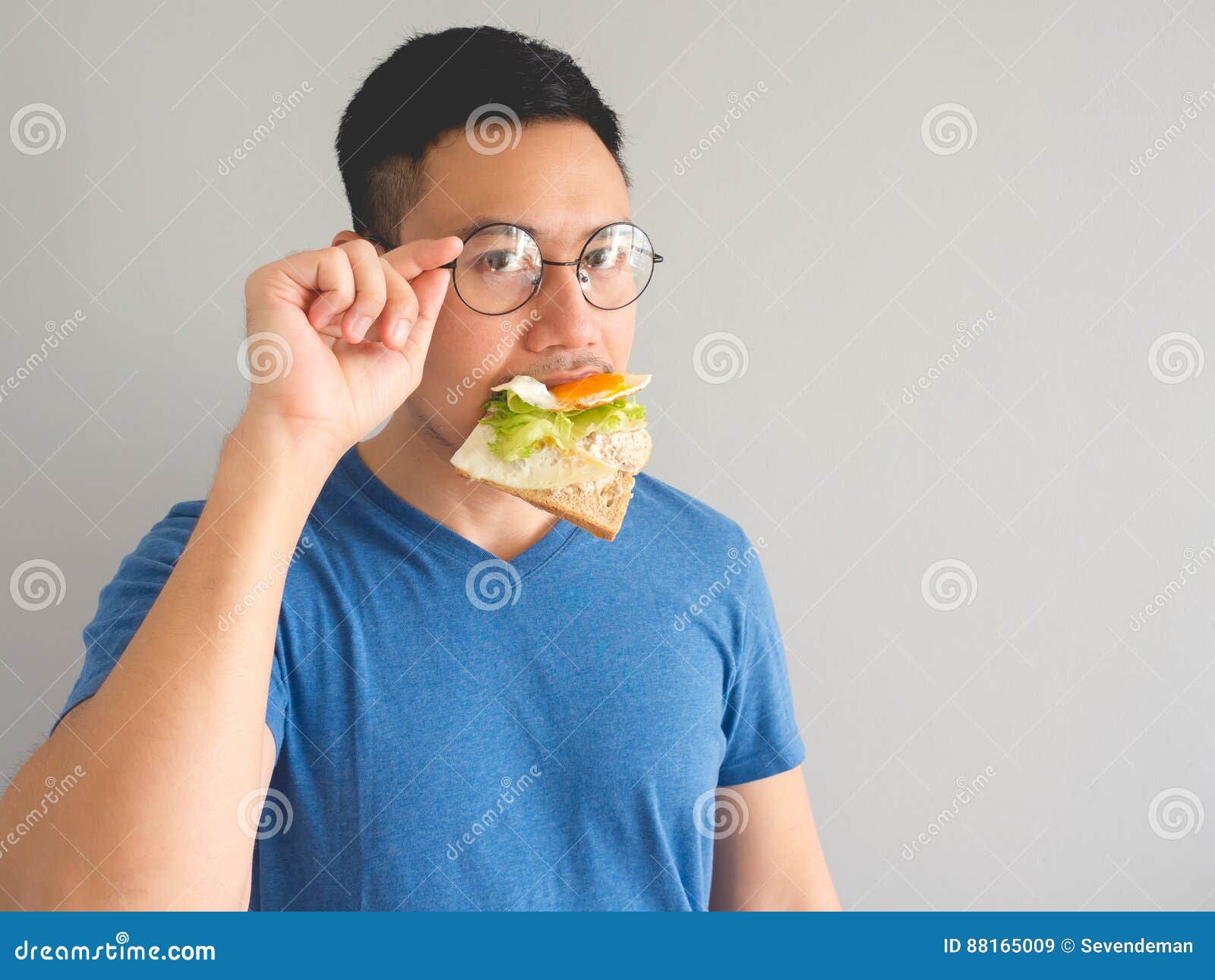 Funny man eat sandwich. stock image. Image of expression - 88165009