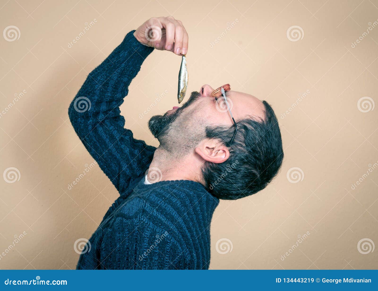 Funny man eating fish stock image. Image of male, adult - 134443219