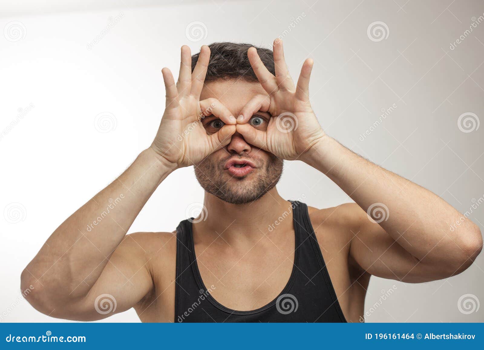Funny Man Looking through Glasses from Fingers Stock Photo - Image of ...