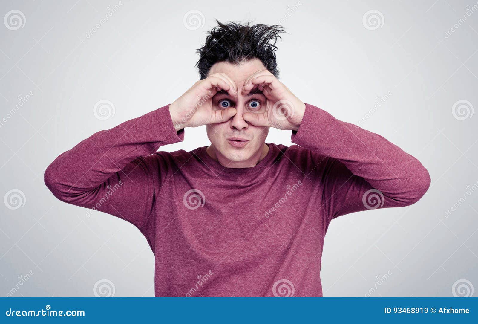 Funny Man Makes the Binoculars Around Eyes from the Hands. Stock Image ...