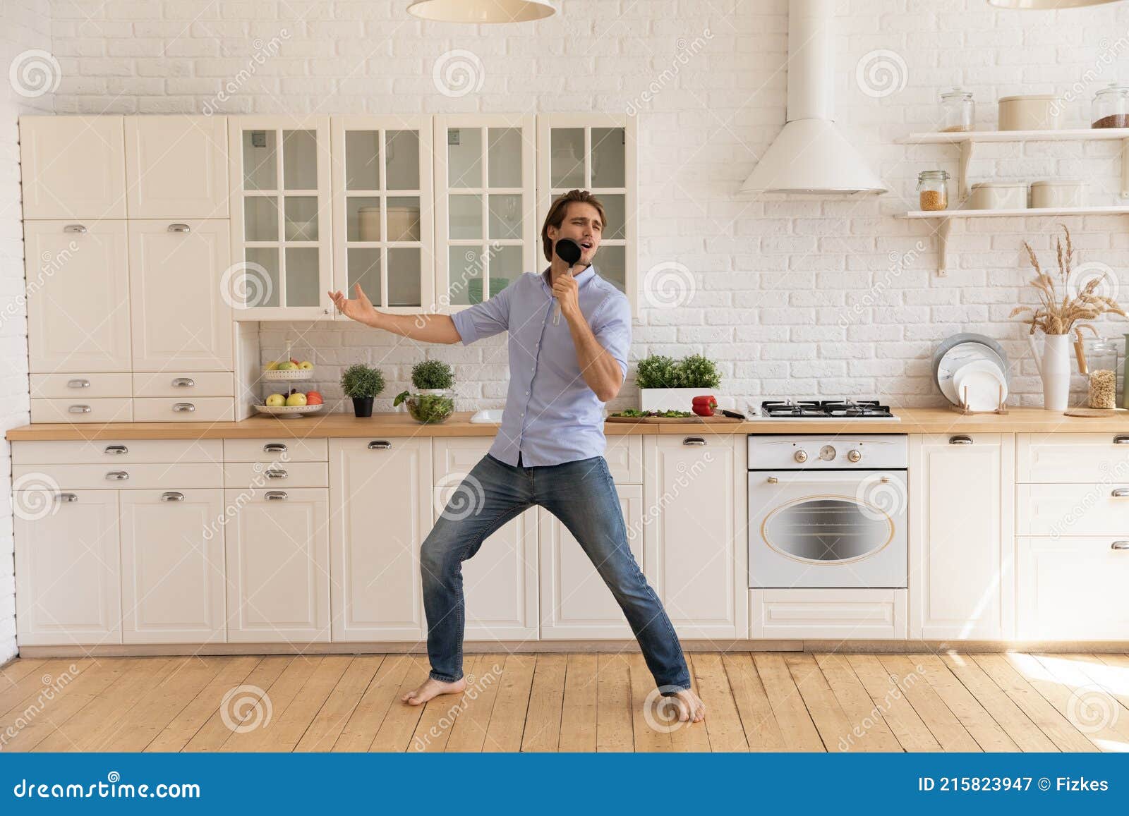 Funny Man Singing into Kitchenware, Dancing, Having Fun in Kitchen ...