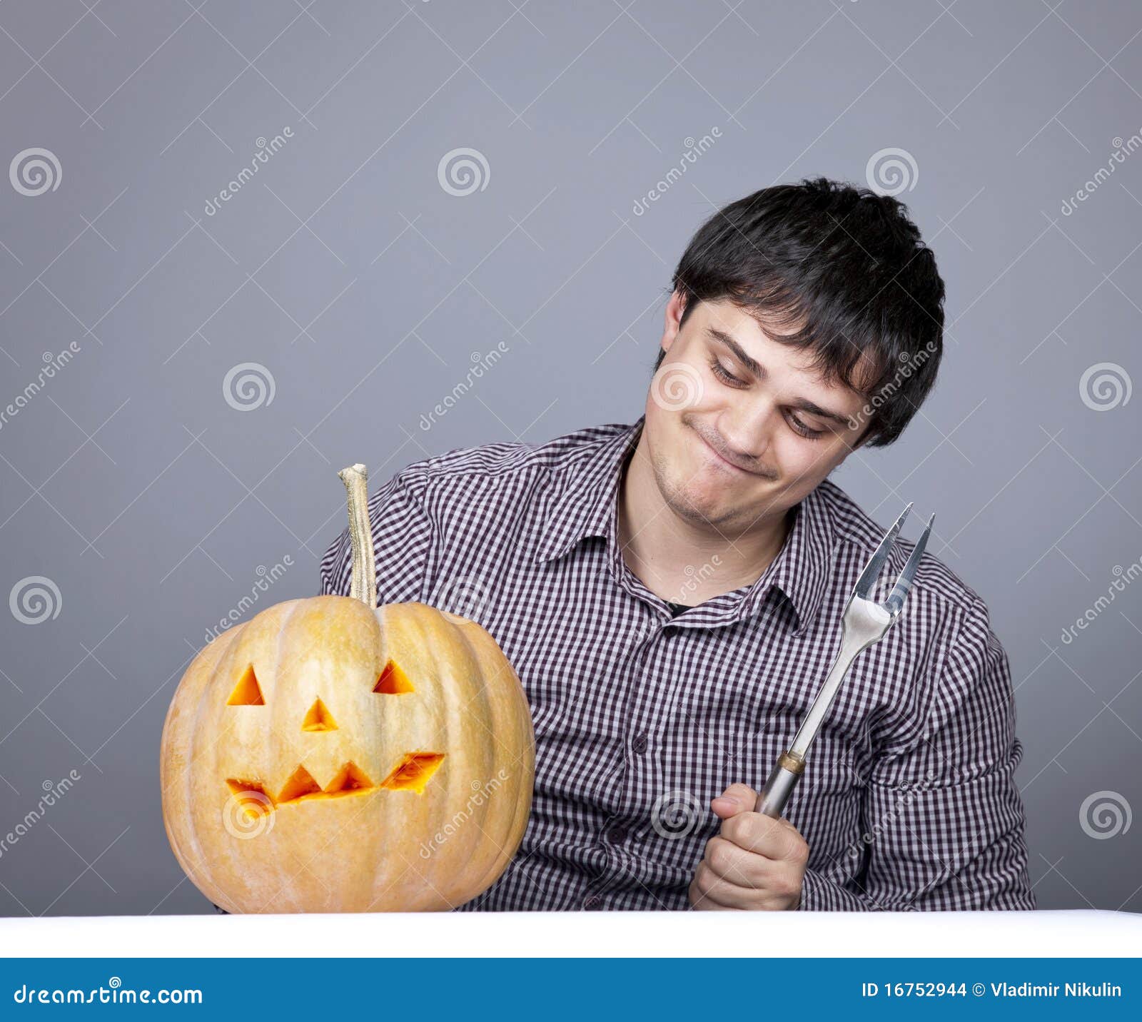 Funny Men with Fork Try To Eat a Pumpkin. Stock Photo - Image of indoor ...