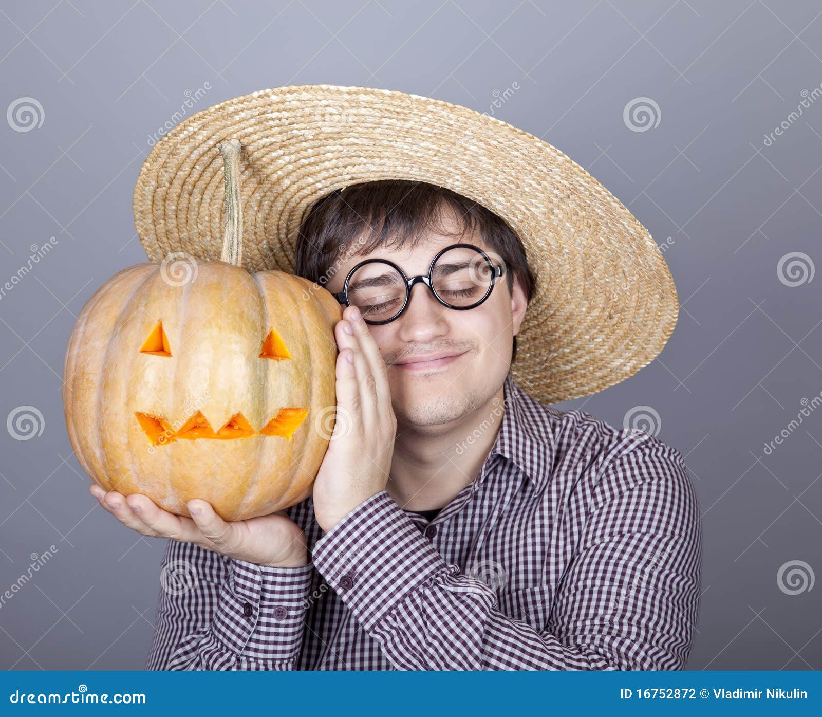Funny Men Try To Eat A Pumpkin. Stock Photo - Image of glasses ...