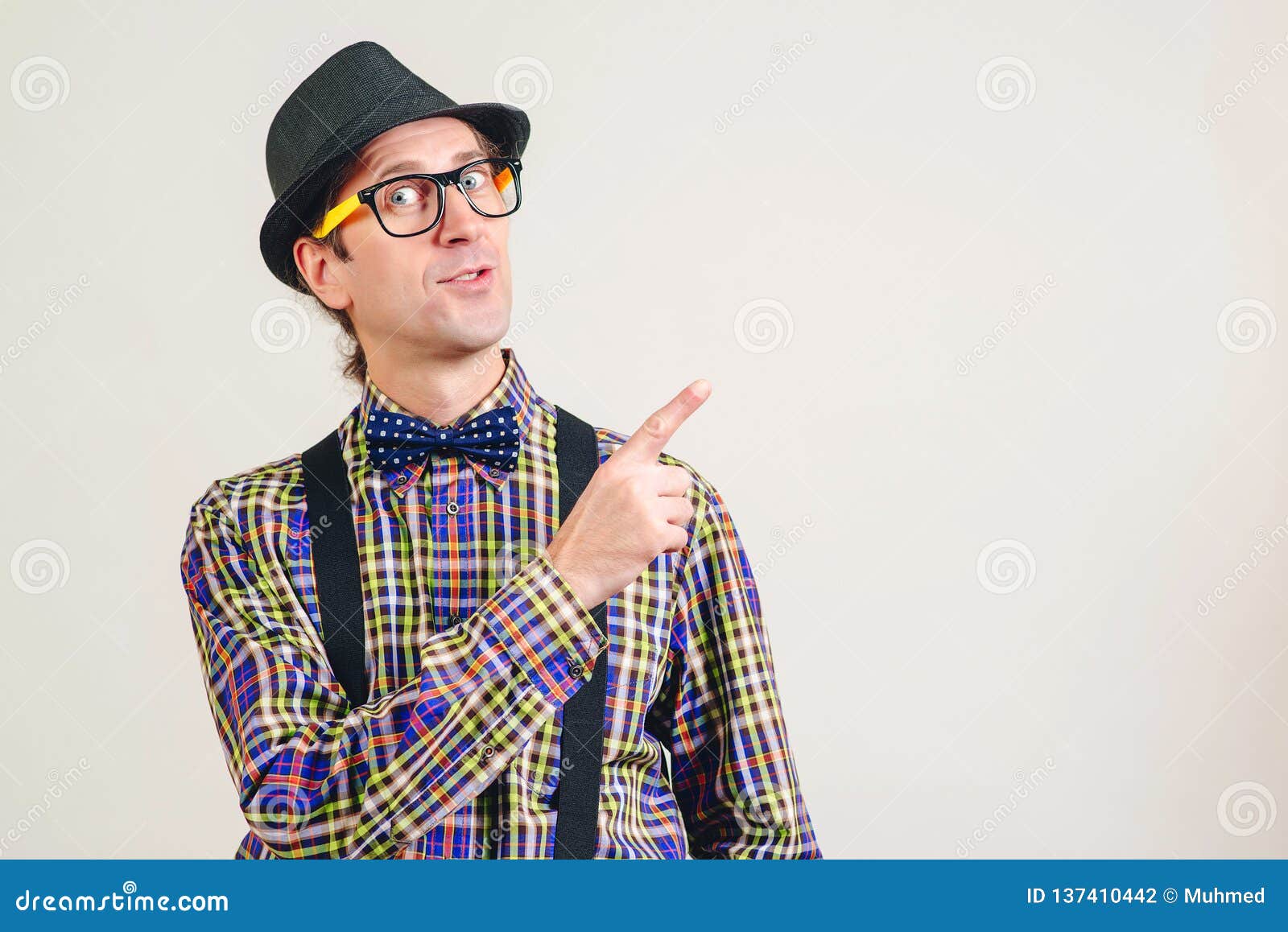 Funny Nerd Pointing Finger Away At Copy Space Smiling Young Nerdy In Glasses Showing Your