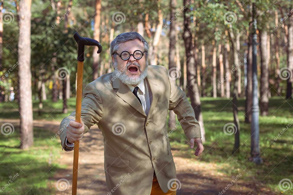 Funny old man with a stick stock photo. Image of ludicrous - 293710112
