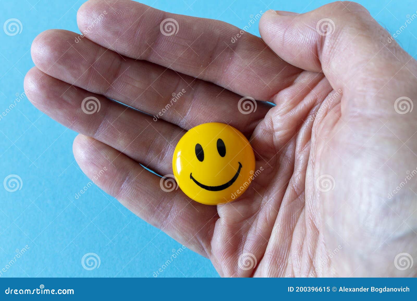 Funny Plastic Smiley Face in a Human Hand. the Concept of a Positive ...