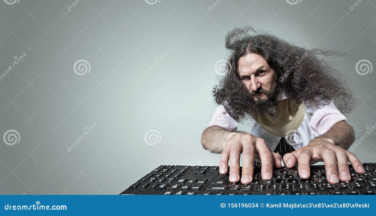 Funny Portrait of a Skinny Nerd Working with a Computer Stock Photo ...