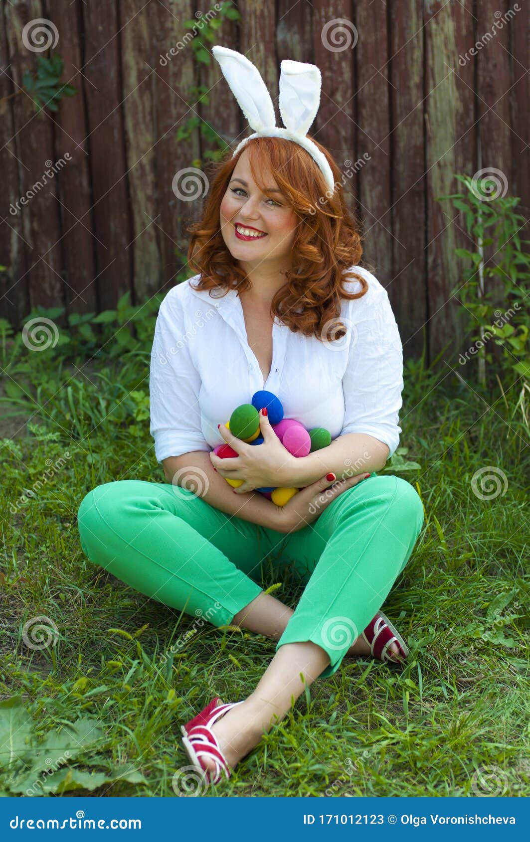 Vertical Photo Of A Pin Up Girl In A Rabbit Costume Who Is Sitting With