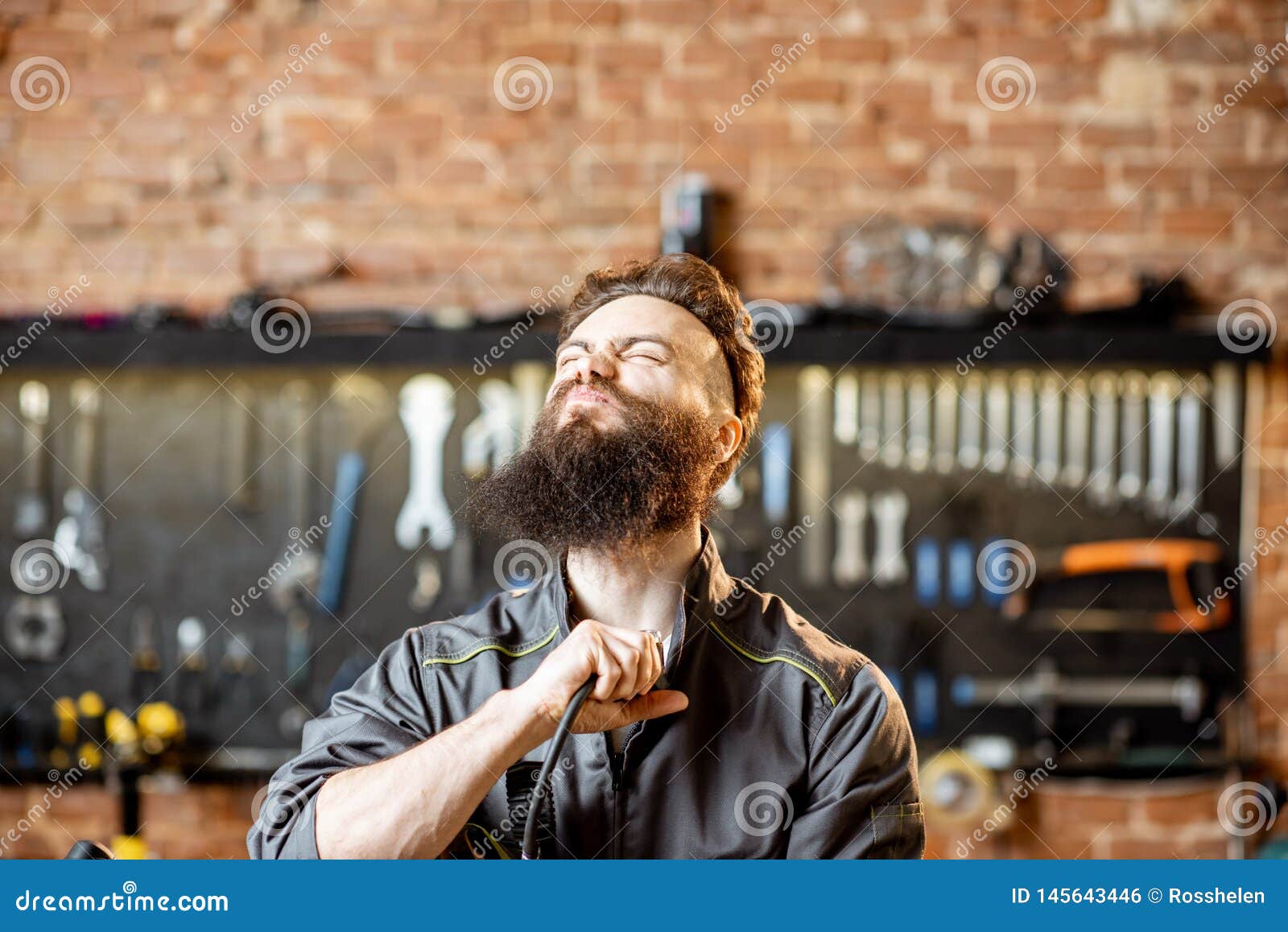 Funny Repairman in the Bicycle Workshop Stock Photo - Image of ...