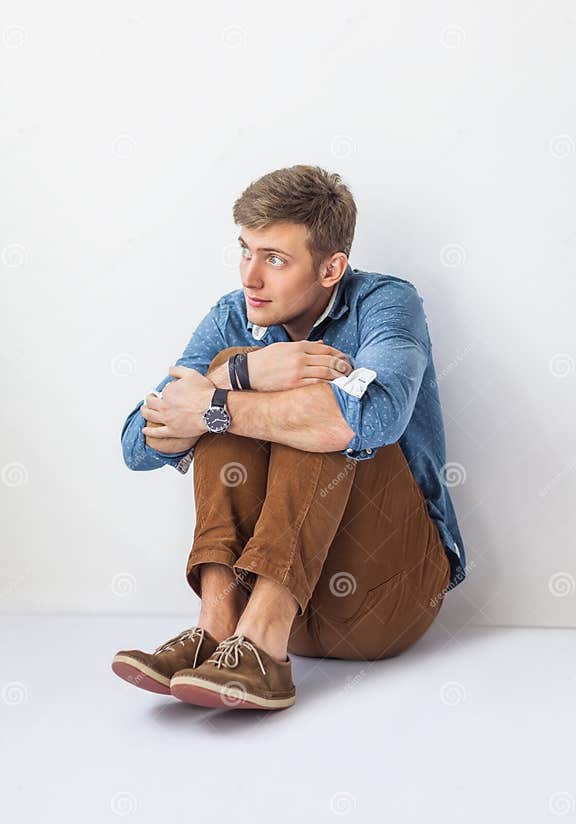Funny Scared Man Sitting on the Floor in Studio Stock Image - Image of ...