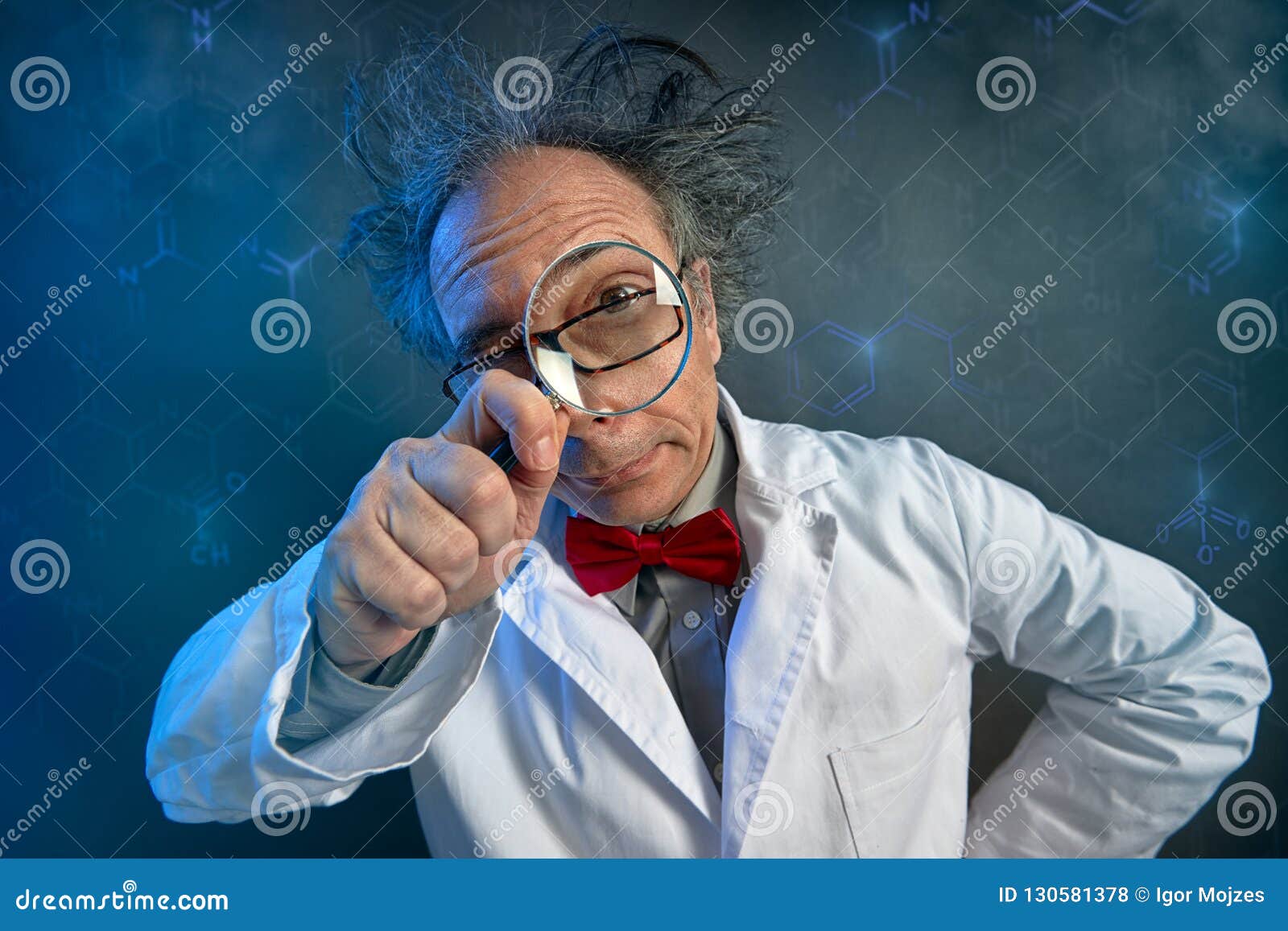 Funny Scientist Looking through a Magnifying Glass Stock Photo - Image ...