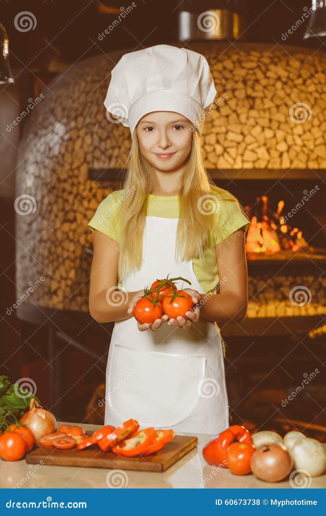 Funny Smiling Chef Girl Holding Tomatoes at Stock Photo - Image of ...