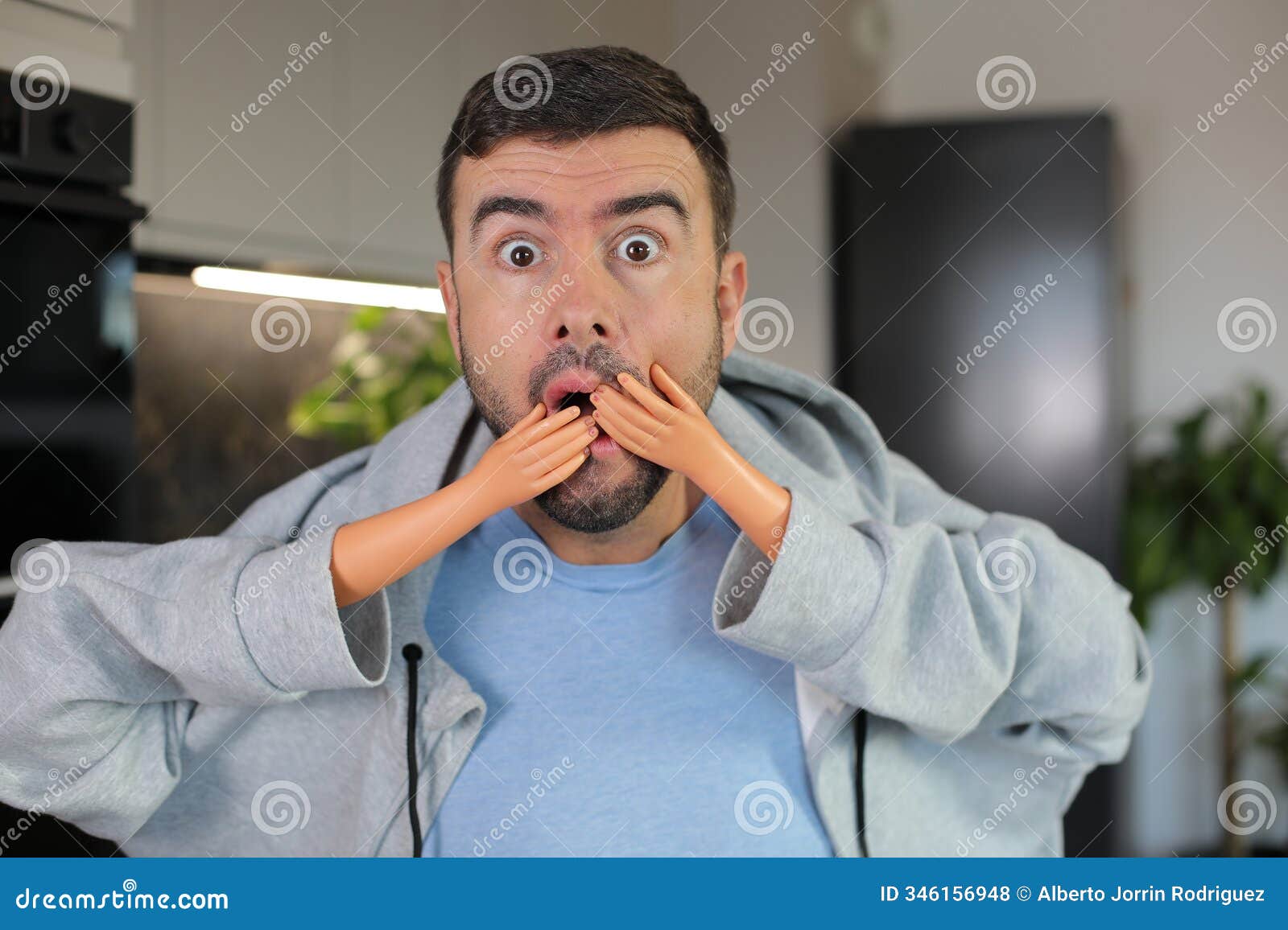 Funny Surprised Looking Man Using Small Toy Plastic Arms Stock Photo ...