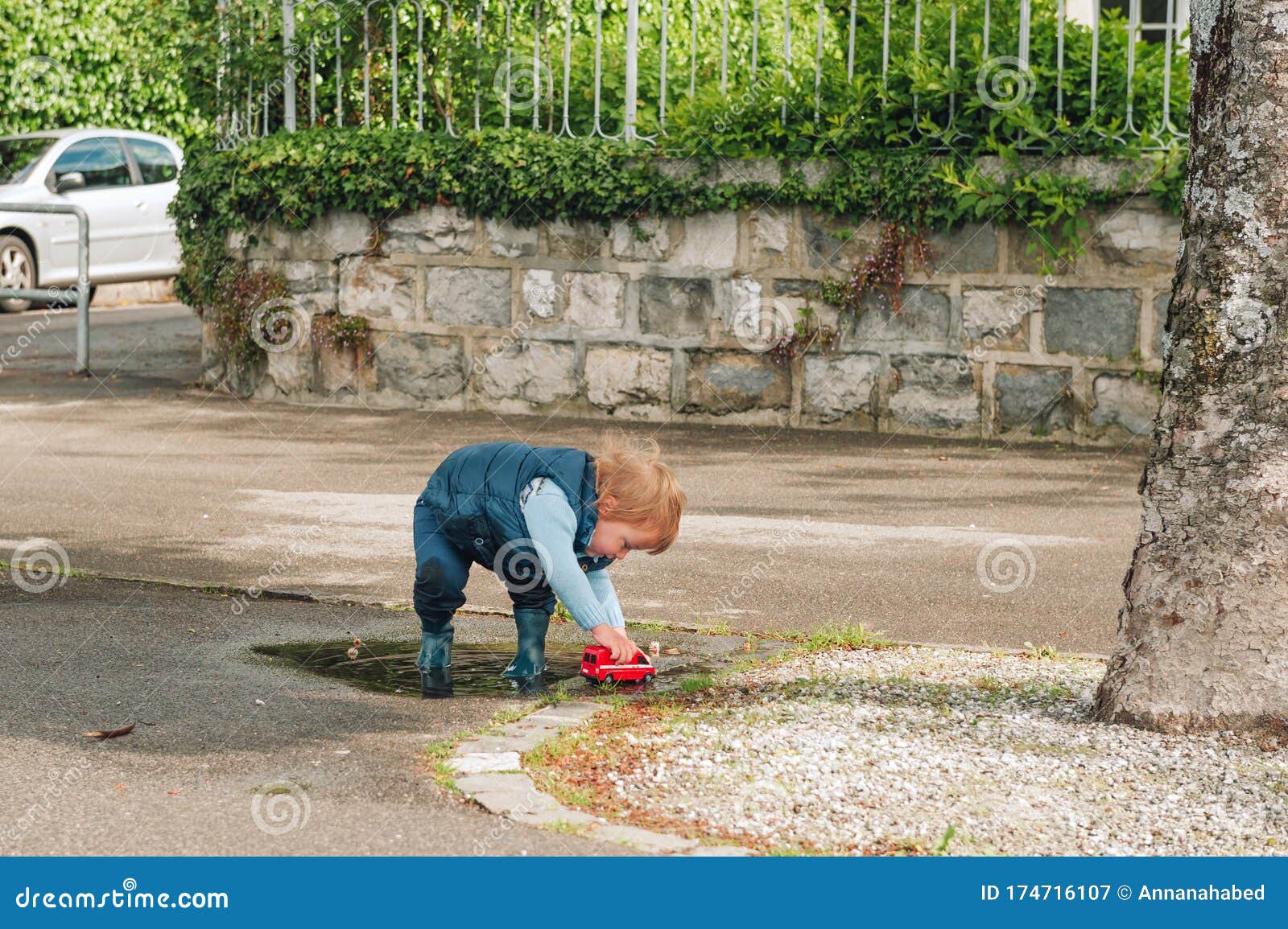 Funny Toddler Boy Playing in the Puddle Stock Image - Image of cold ...